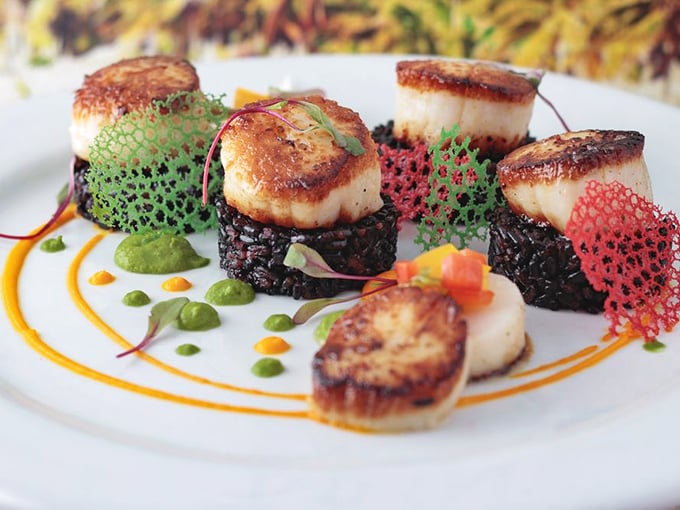 Seared scallops on a bed of black rice &ndash; it's like formal wear for your taste buds. Tuxedo optional, appetite required!