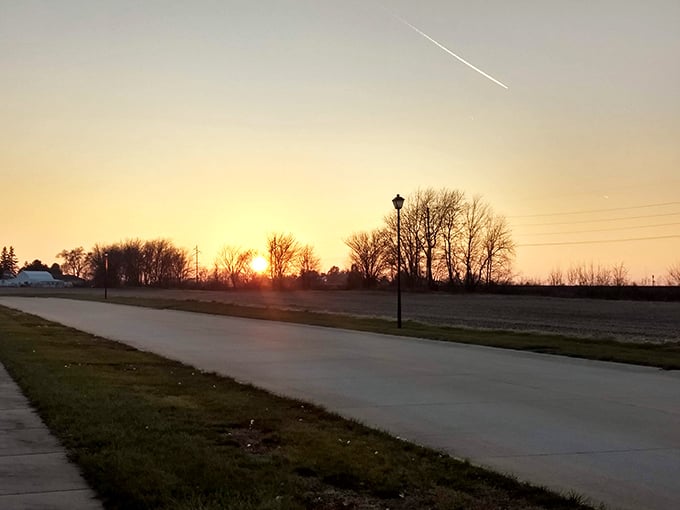 Sunset over Arthur: Where the day's end paints the sky in hues that would make Bob Ross weep with joy. Nature's own light show, free of charge!