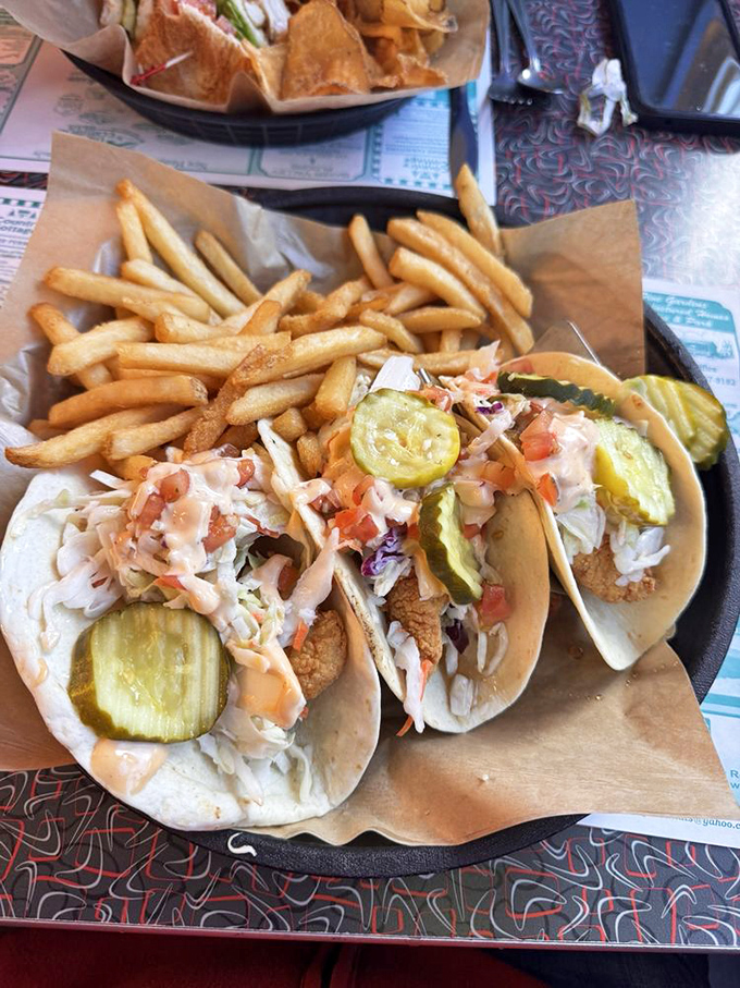 Taco Tuesday meets pizza night in this culinary mashup. With a side of golden fries, it's a fiesta of flavors that knows no borders.