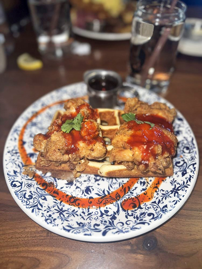 Chicken and waffles: the original "why didn't I think of that?" culinary masterpiece, elevated here with a sauce that glistens with possibility.