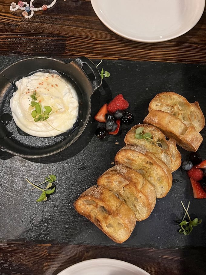 Warm, pillowy bread meets creamy ricotta dip with fresh berries&mdash;a starter so good you'll contemplate canceling your entr&eacute;e altogether.