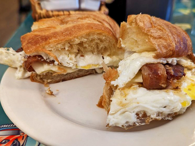The holy trinity of breakfast: bacon, egg, and cheese. Nestled in a flaky croissant, it's a handheld miracle.