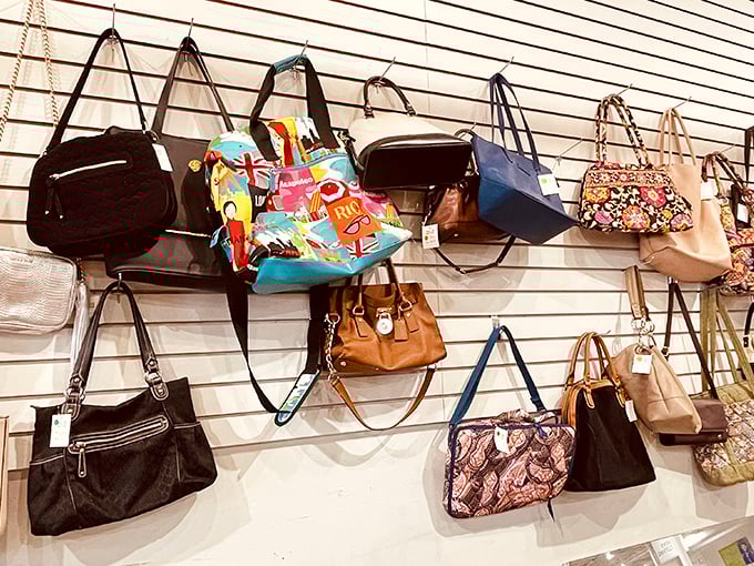 A handbag heaven where leather, canvas, and designer purses hang in suspended animation, waiting for their next shoulder to grace.