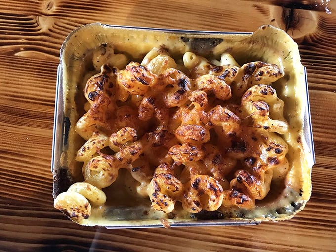 Baked mac and cheese that's cheesier than your uncle's jokes at Thanksgiving. This gooey goodness is what comfort food dreams are made of.