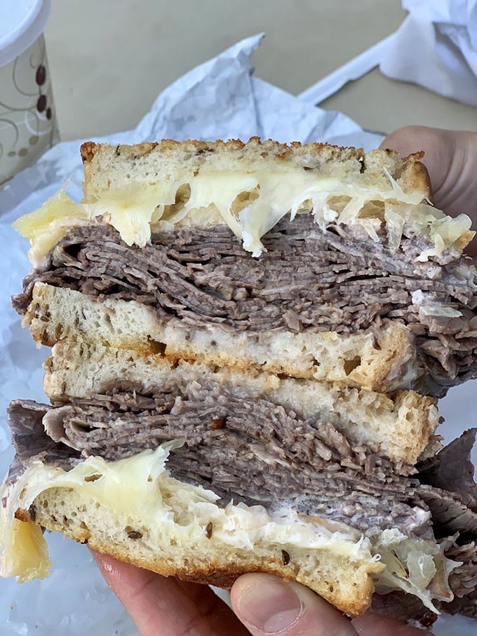 The Brisket Reuben Fresser: a sandwich so massive, it comes with its own zip code. Prepare for a delicious food coma!