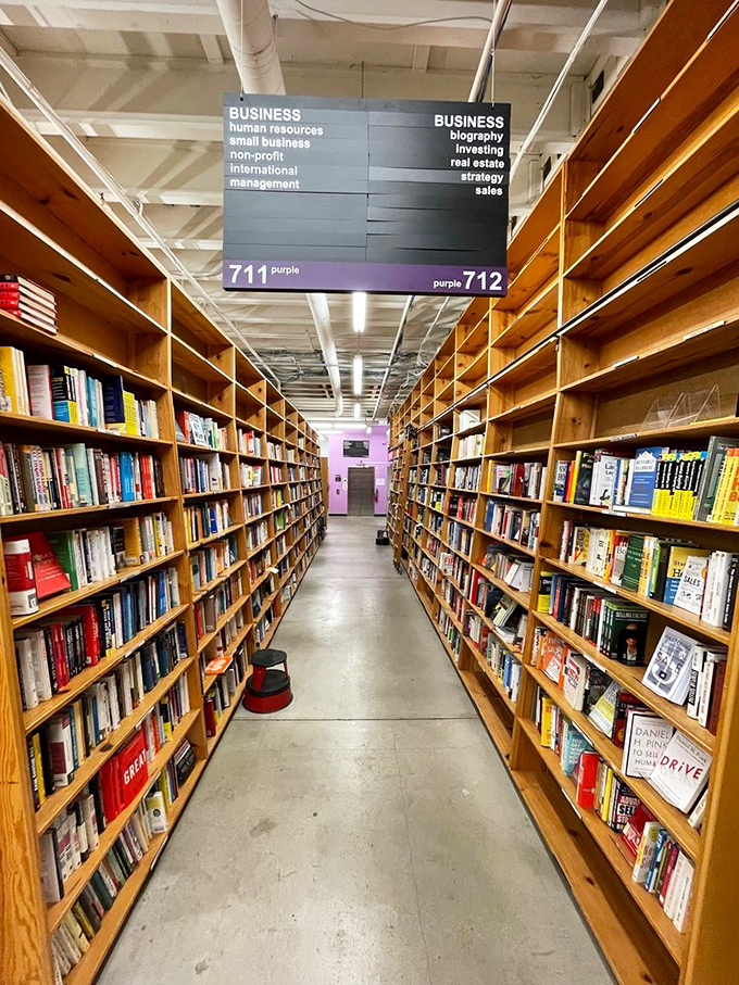 Business books aisle: where dreams of corner offices are born. It's like a gym for your career ambitions, no sweat required.
