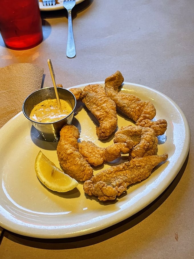 Cajun catfish fingers: The South's gift to the Midwest. Crispy, spicy, and more addictive than your favorite Netflix series. Warning: May cause spontaneous "yeehaws."