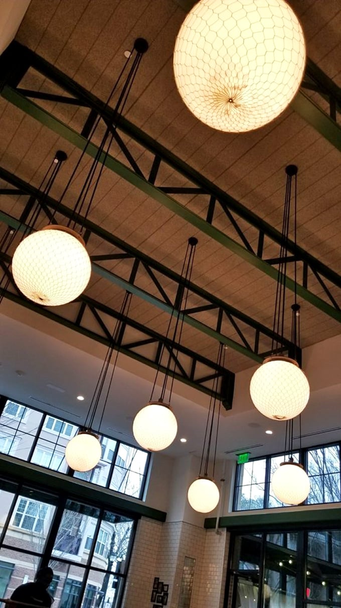 Illuminating design! These pendant lights aren't just brightening the room, they're setting the mood for culinary magic.