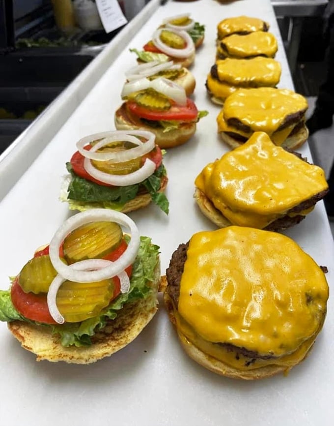 Cheeseburger paradise! These beauties are lined up like the world's most delicious choir. Each one sings a siren song of melty cheese and juicy perfection.