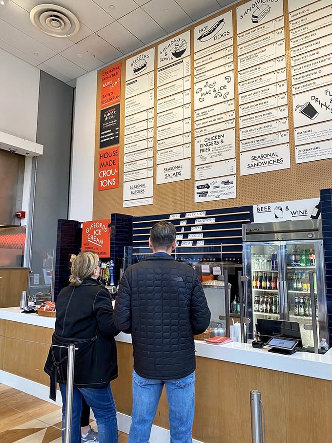 The ordering counter&mdash;where dreams begin and hunger ends. That menu board is basically a roadmap to happiness.