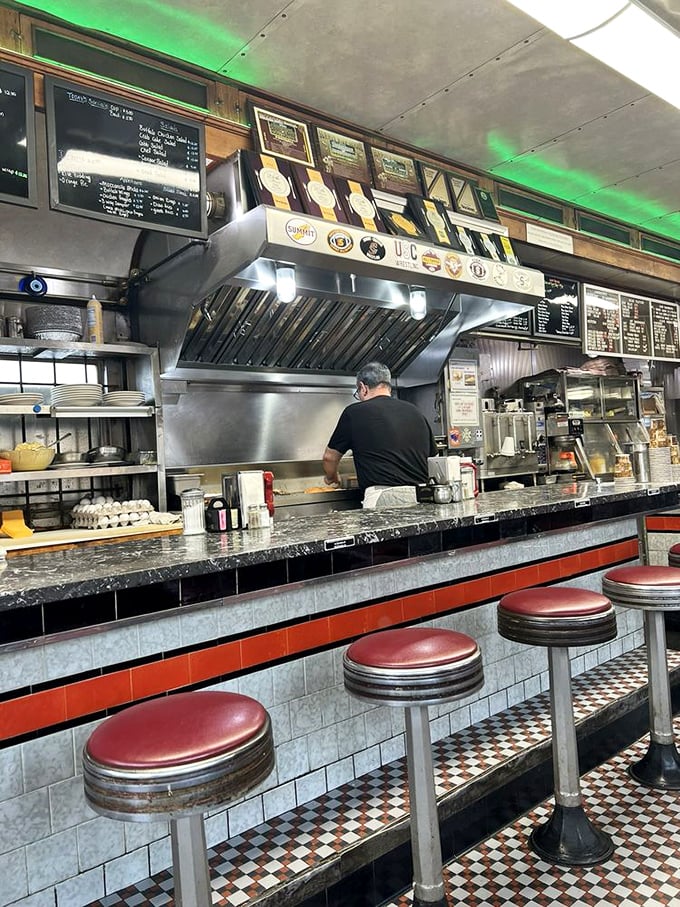 The counter &ndash; where strangers become neighbors and the cook's rhythmic spatula work provides the soundtrack to your morning ritual.