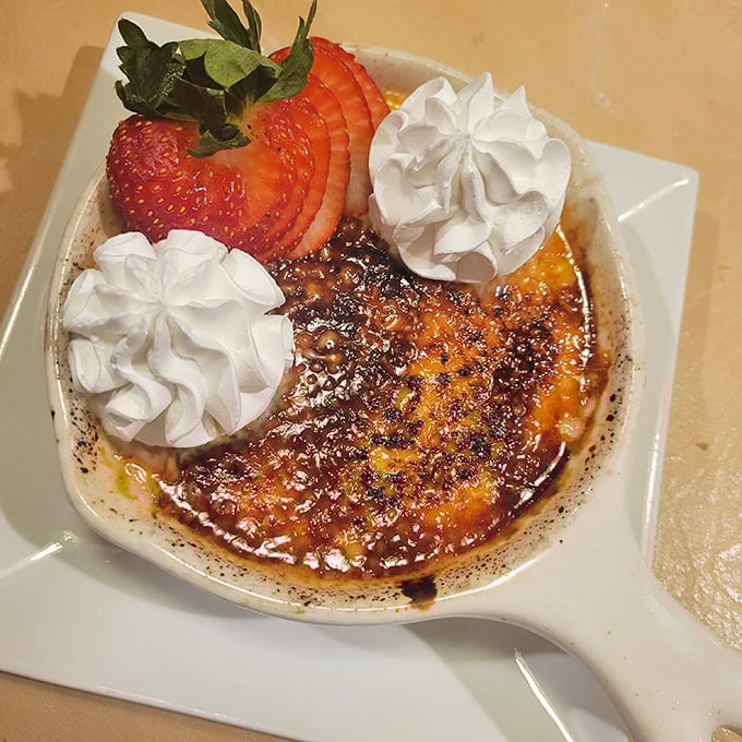 Cr&egrave;me br&ucirc;l&eacute;e: where dessert meets pyrotechnics. Crack that caramelized top and dive into creamy bliss&mdash;no passport required.