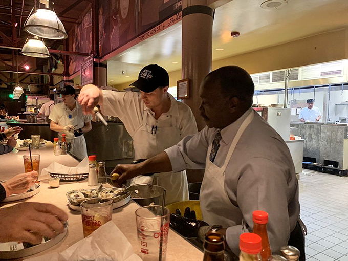 Masters at work. Watching these culinary wizards is like seeing a well-choreographed dance, but with more butter and less tutus.