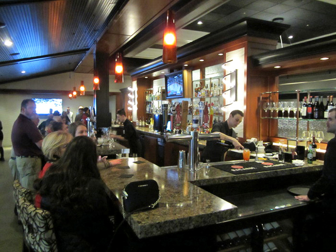 A bustling bar scene that's livelier than a school of fish during feeding time. Here, the drinks flow as freely as the conversation.