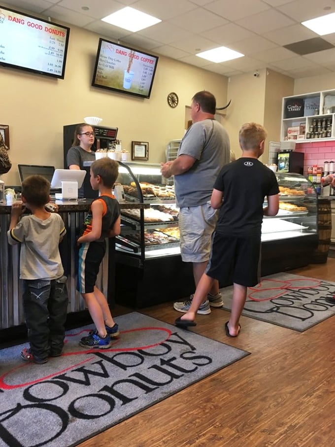 Family donut expedition in progress! These folks know that the best adventures start with a sugar rush.
