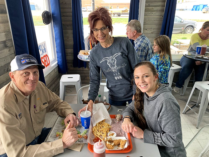 Happy diners, delicious food, and good company. This scene is warmer than a fresh-from-the-oven apple pie on a crisp fall day.