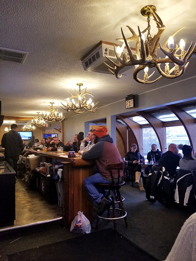 The bar area: where antlers meet aperitifs. It's the perfect spot to swap tall tales over a cold one, surrounded by decor that screams "wilderness chic."