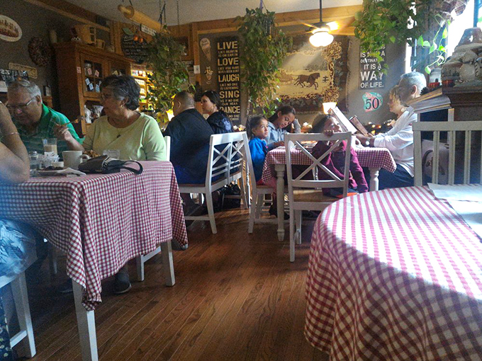 Where strangers become friends over slices of pie. This bustling dining area is proof that good food brings people together. It's like a delicious United Nations of dessert lovers.