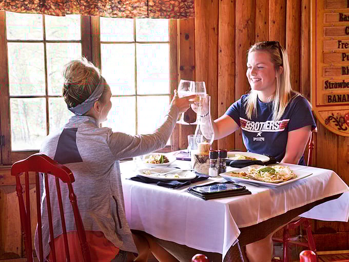 Cheers to good company and great food! These diners know the secret to happiness: friends, wine, and a table full of deliciousness.
