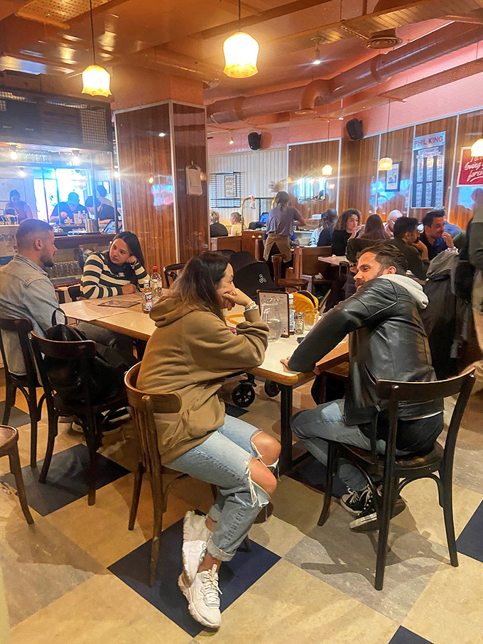 Breakfast is better with friends! This lively dining room is buzzing with conversation and the clinking of forks against plates – pure morning magic.