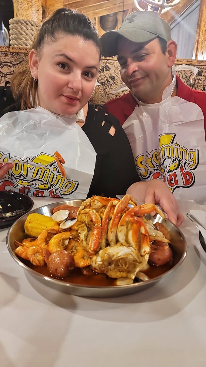 All hands on deck! These happy diners are suited up for a seafood battle royale. May the best appetite win!