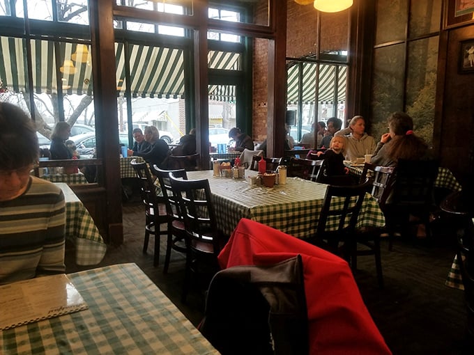 A bustling dining room filled with happy eaters. It's like a Norman Rockwell painting come to life, but with better food and fewer awkward family moments.