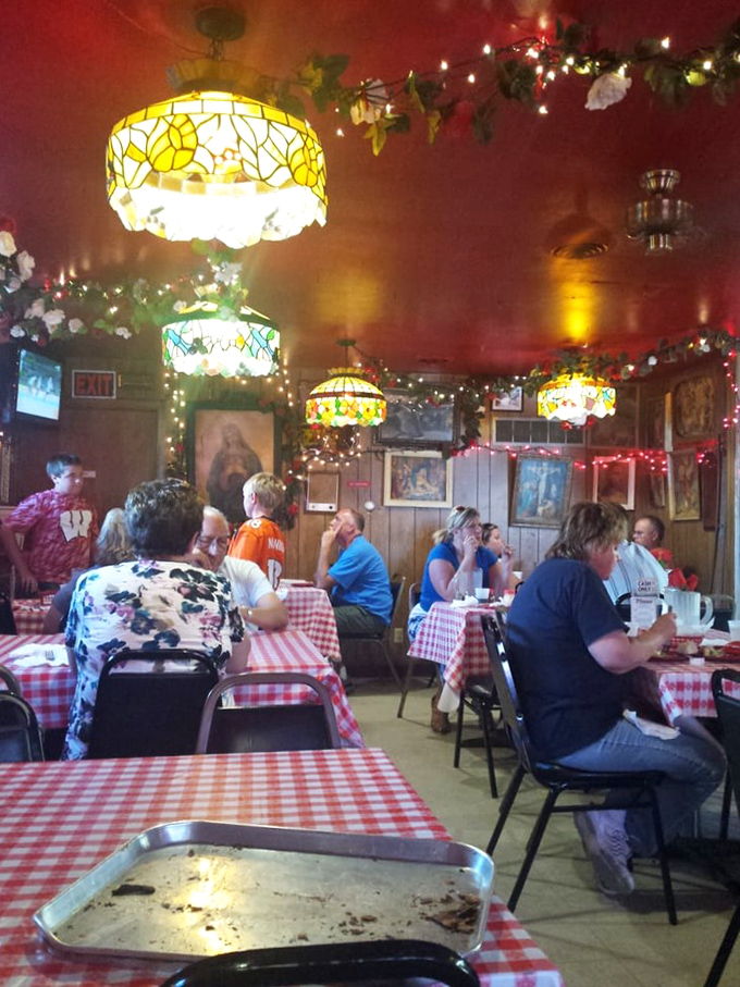 Happy faces and full plates - the universal language of great pizza! This scene captures the joy of sharing a meal at Maria's.