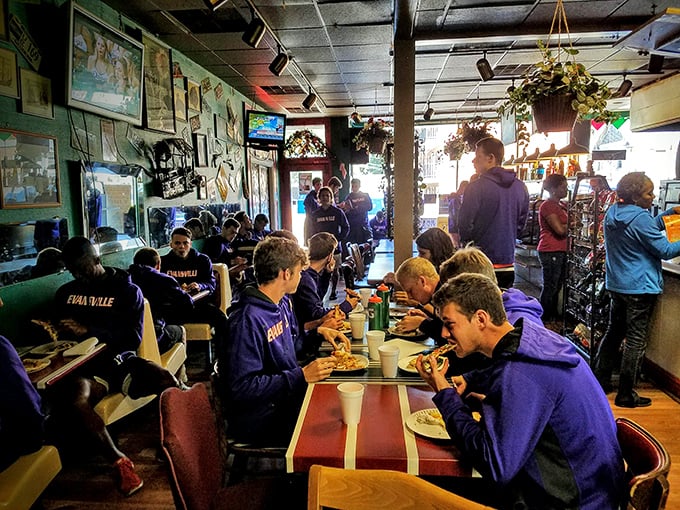 Purple pride on full display! These young diners prove that nothing brings a team together quite like the power of pizza.