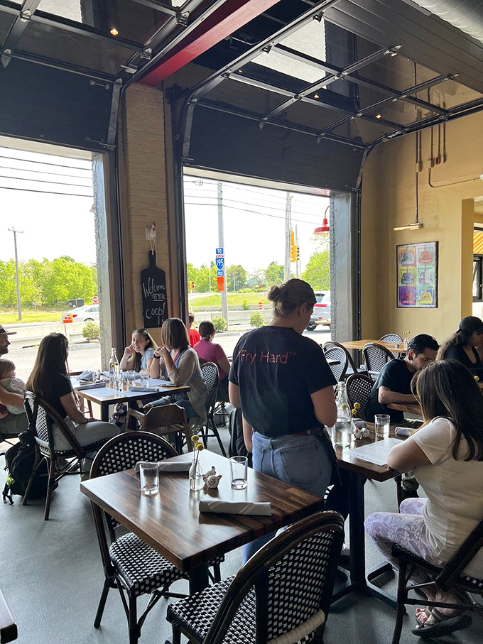 When the garage door opens, the boundary between inside and outside disappears. That "Fry Hard" t-shirt says it all.
