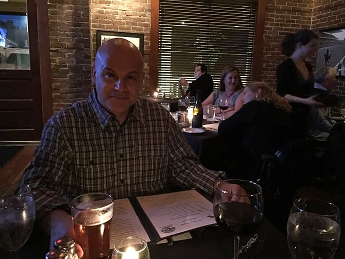 A scene that's cozier than your grandmother's living room. Here, strangers become friends over shared stories and sizzling steaks.