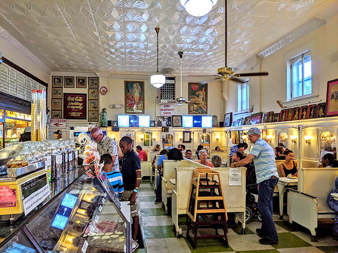 Where everybody knows your name... and your favorite milkshake! This bustling dining area is the heart of Crown Candy Kitchen's charm.
