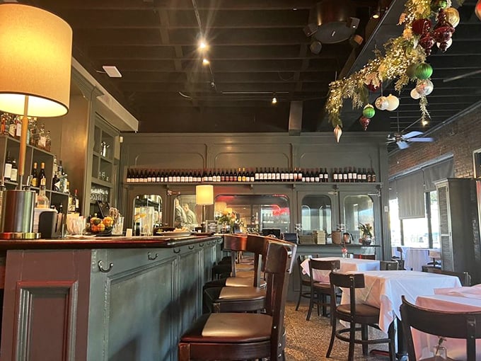 The dining room balances intimacy with energy, where conversations flow as smoothly as the wine from that impressive bottle collection.