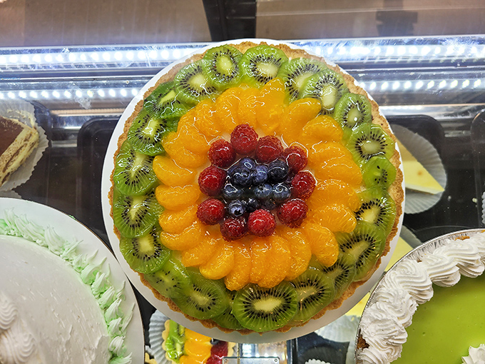 Mother Nature's sweetest masterpiece! This fruit tart is so vibrant, it could double as modern art in a fancy gallery.