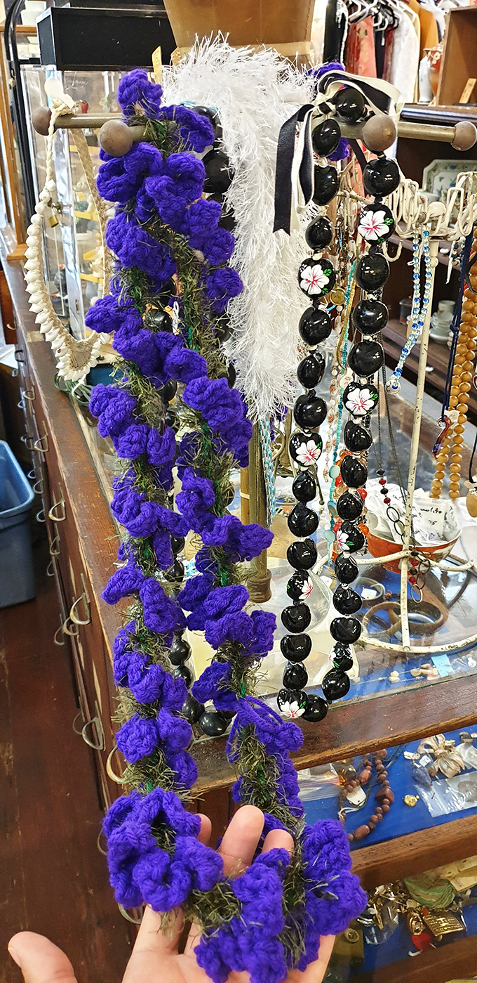 Purple reign! These leis aren't just accessories; they're wearable pieces of Hawaiian history. Time to get your royal on!