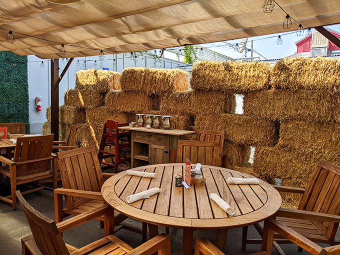 Who needs a vineyard view when you can dine al fresco next to a wall of hay? It's like a five-star picnic, minus the ants.