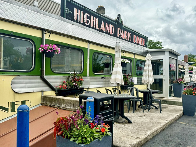 Summer brings outdoor seating adorned with hanging flowers, proving that even classic diners understand the importance of ambiance.