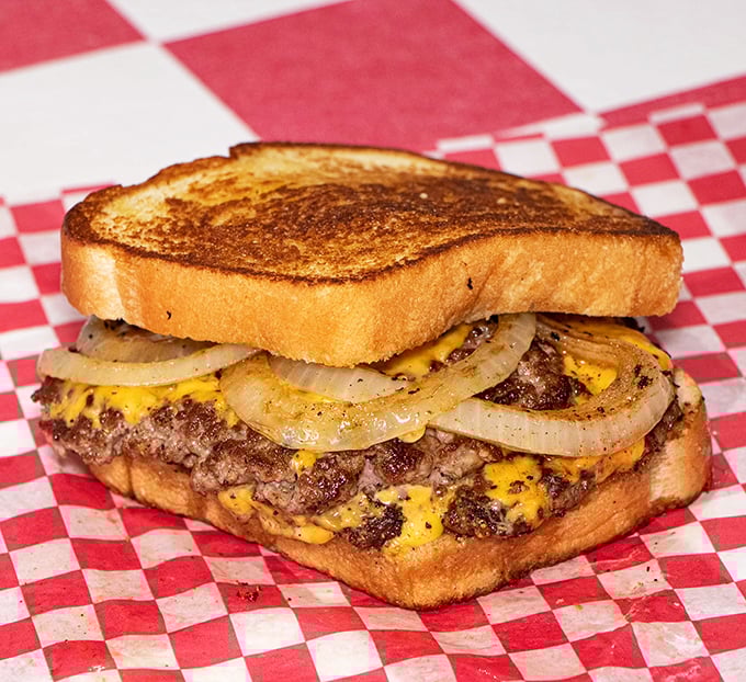 Behold, the mighty patty melt! It's like a cheeseburger and grilled cheese had a baby, and we're all invited to the delicious celebration.