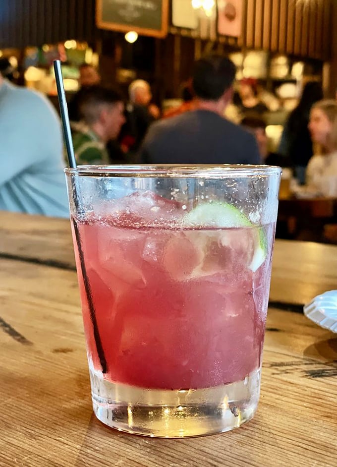 A cocktail that says "I'm sophisticated, but I also appreciate good barbecue." The pink gin fizz&mdash;where high-class meets high-flavor.