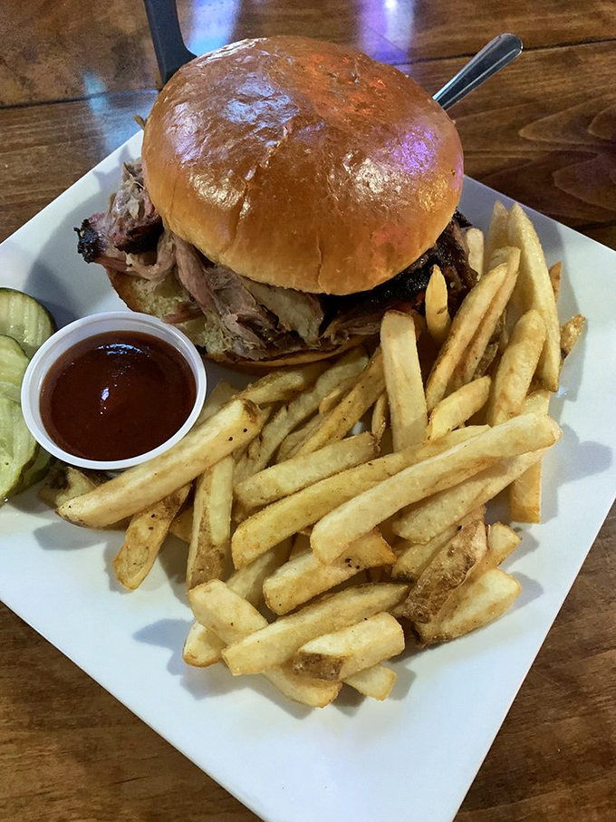 This pulled pork sandwich is ready for its close-up. Juicy, saucy, and flanked by crispy fries &ndash; it's the A-list celebrity of comfort food.