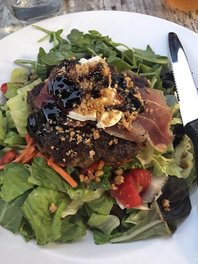 Even the salads here are rebellious. This leafy creation is topped with enough goodies to make you forget you ordered a "healthy" option.