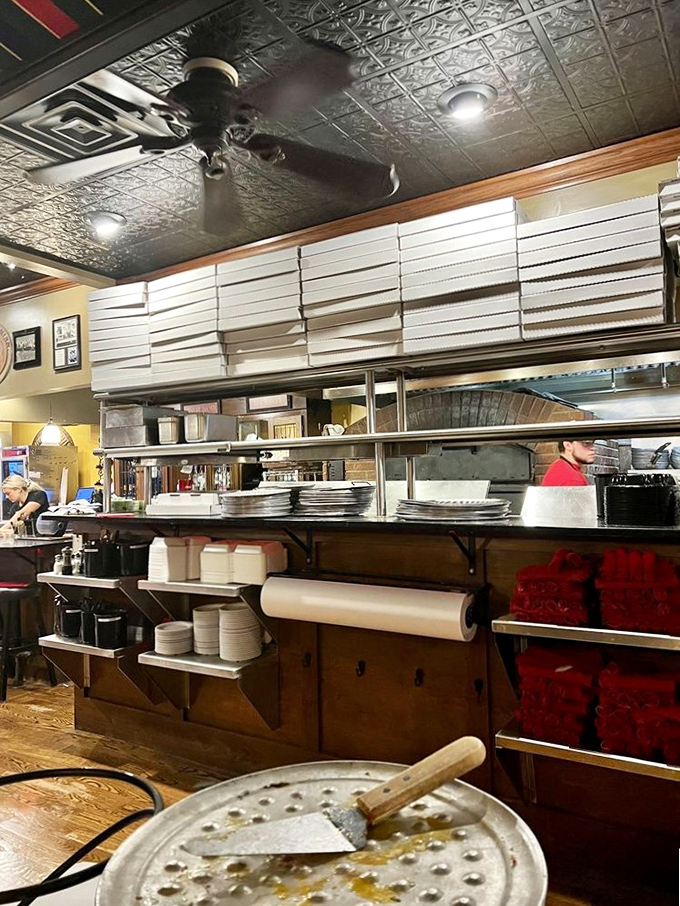 Behind the scenes of deliciousness! The serving station stands ready to deliver piping hot slices of joy.