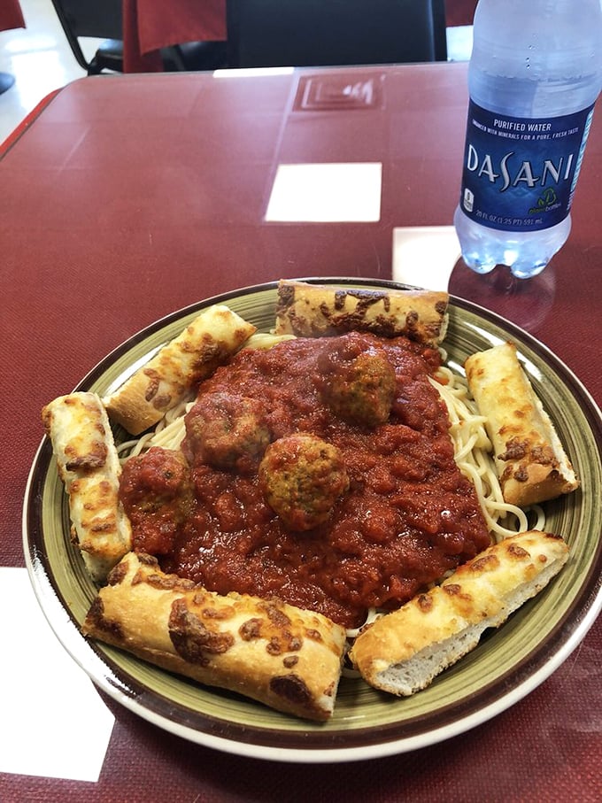 Mama mia! This plate's got more Italian flair than a Vespa scooter rally. Spaghetti, meatballs, and garlic bread &ndash; the holy trinity of comfort food.