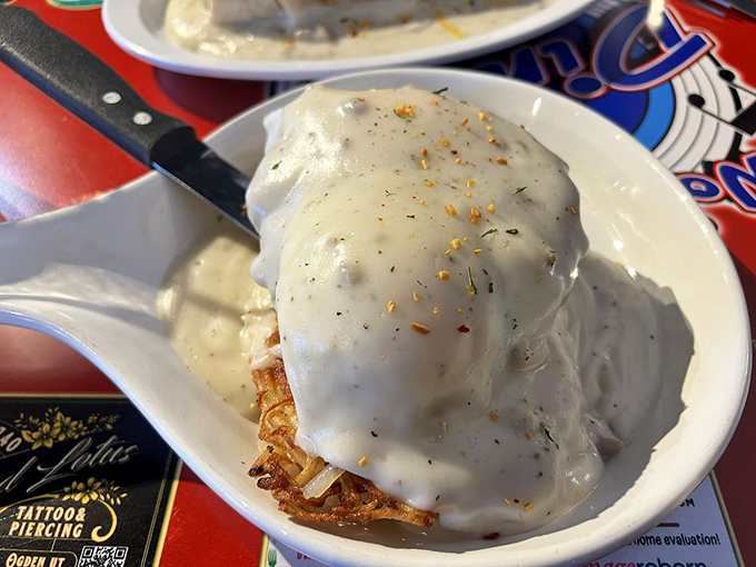 The Stacker: A tower of deliciousness that defies gravity and common sense. It's like Jenga, but with gravy and zero chance of collapse.