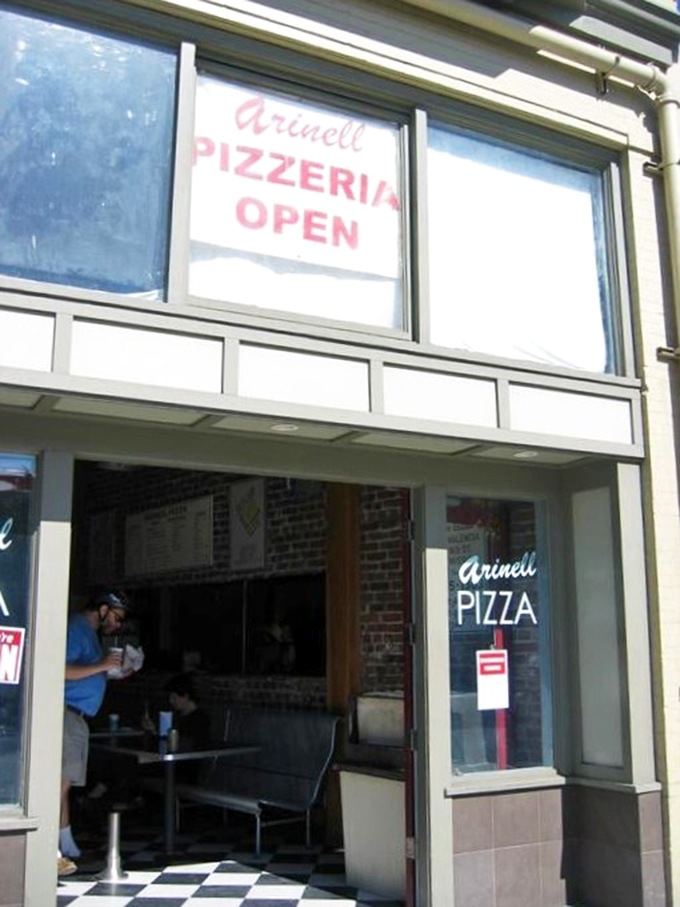 Open sesame to flavor town! Arinell's entrance is your portal to a world of cheesy, saucy delights.