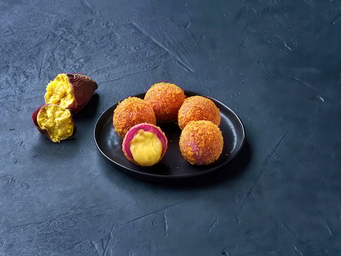 Sweet potato balls with their crispy exterior and vibrant centers &ndash; like little edible jewels. Dessert that doesn't apologize for being both beautiful and delicious.
