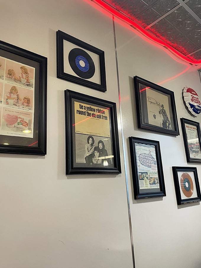 Wall of fame or time machine? Penny's decor is a nostalgic journey through pop culture, complete with vinyl records and vintage ads.