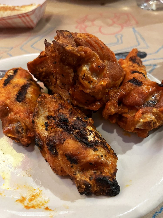 Buffalo wings with an attitude. These crispy, saucy morsels are ready to fly right into your mouth &ndash; no frequent flyer miles required.