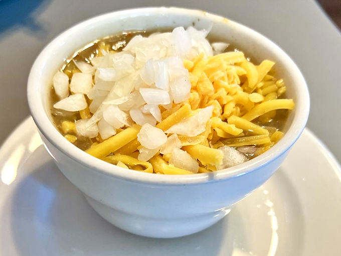 A bowl of liquid sunshine! This green chili promises to warm your soul and kickstart your taste buds.