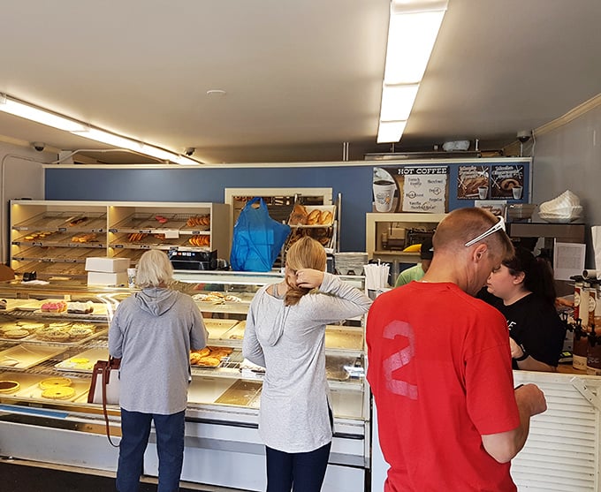 The line of anticipation! These customers know that good things come to those who wait... especially when those good things are freshly baked donuts.