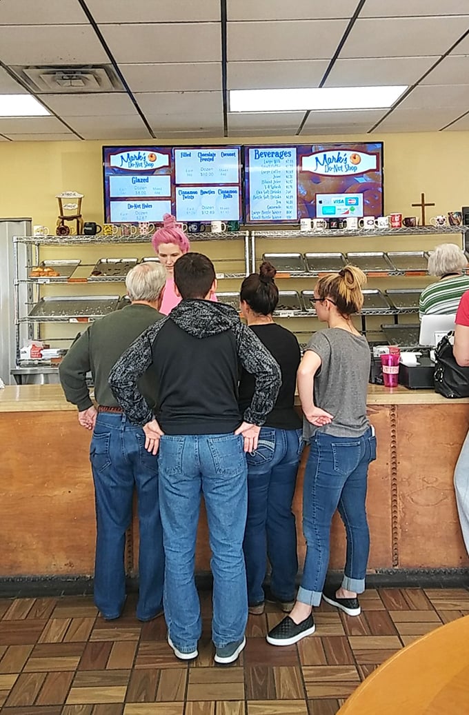 The donut lineup! These eager customers know the early bird gets the warm, fresh-from-the-fryer worm... I mean, donut.